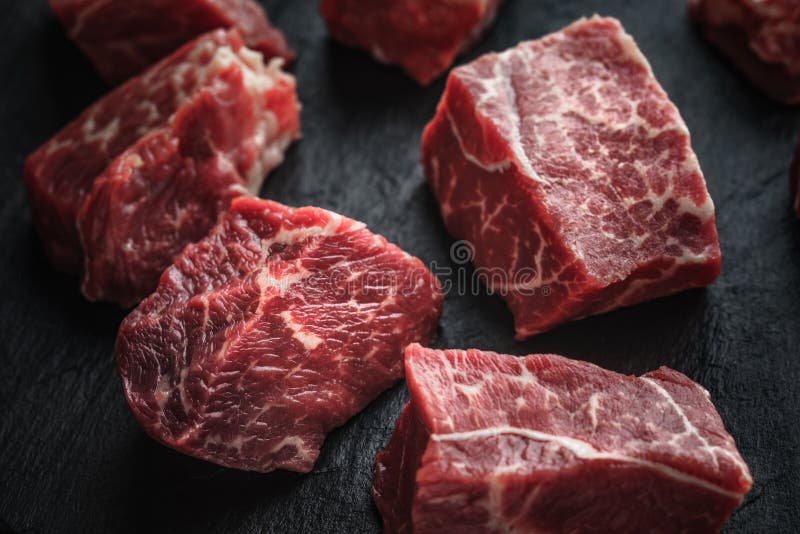 Raw Angus Beef Slices on the Black Stone Table Horizontal Stock Photo ...