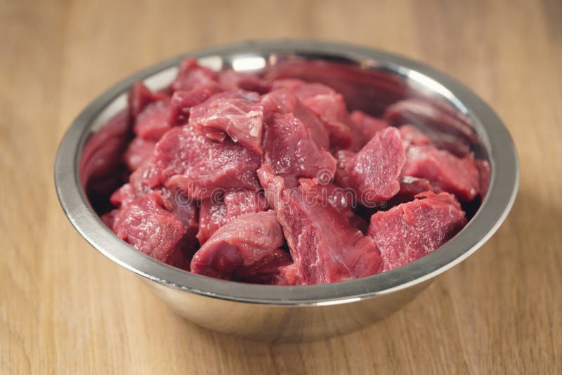 Raw beef in bowl closeup stock photo. Image of parts - 92394224