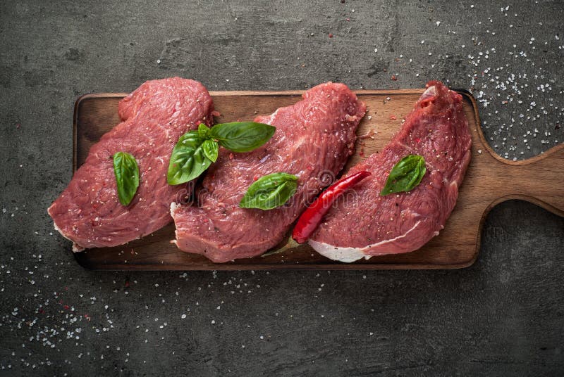 Raw beef chop stock photo. Image of eating, herb, black - 77273058