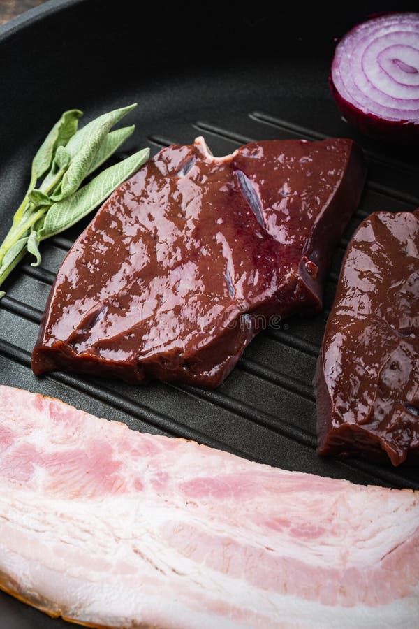 Raw Beef Liver Sliced with Bacon on Grill Pan Over Rustic Background ...