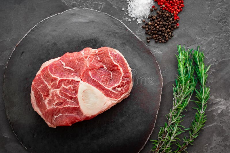 Raw Beef Meat Osso Buco Steak on Round Slate Stock Image - Image of ...