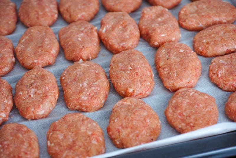 Raw Beef Patties on a Baking Tray Stock Photo - Image of tray, prepare ...