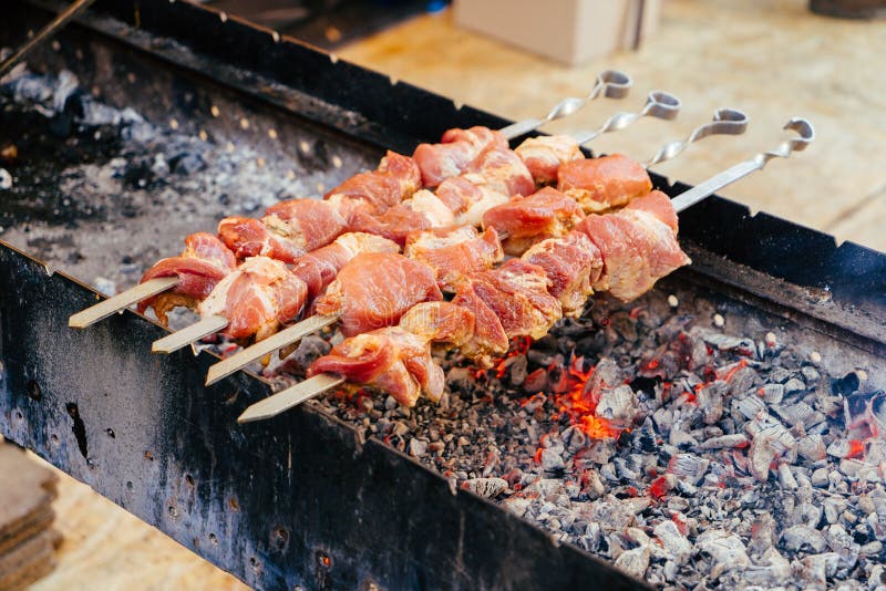 Raw beef on russian grill. stock image. Image of flame - 56069103
