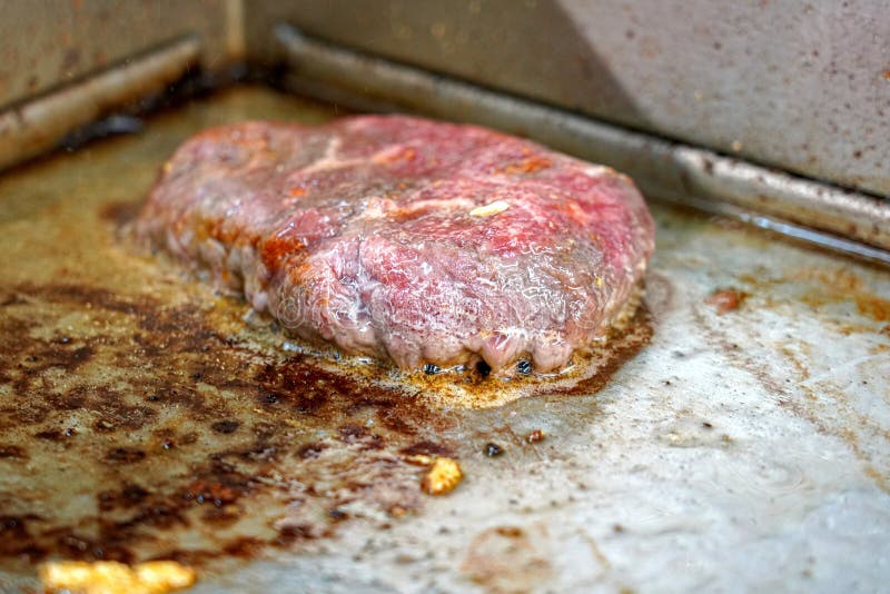 Raw Beef Steak is Fried on a Stove in a Restaurant Kitchen Stock Image ...