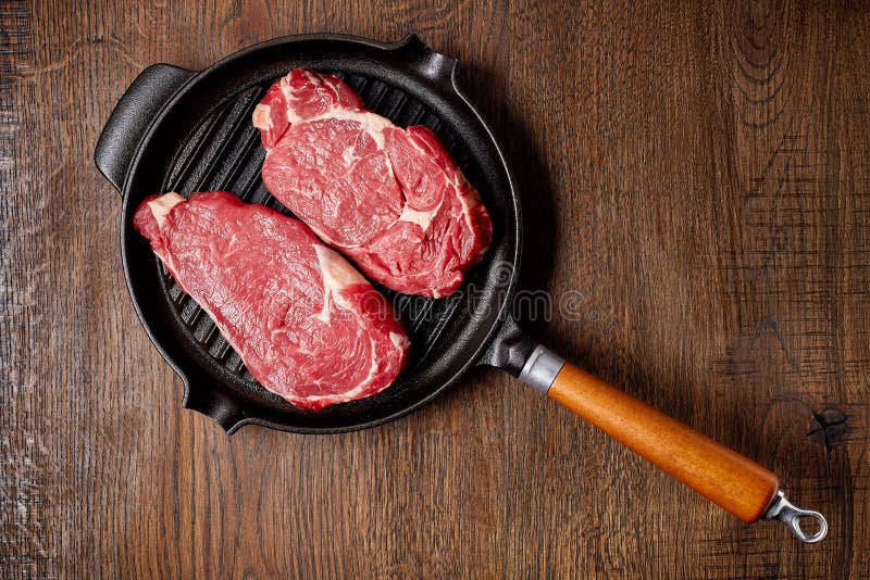 Raw Beef Steak on Grill Pan from Above Stock Photo - Image of frying ...