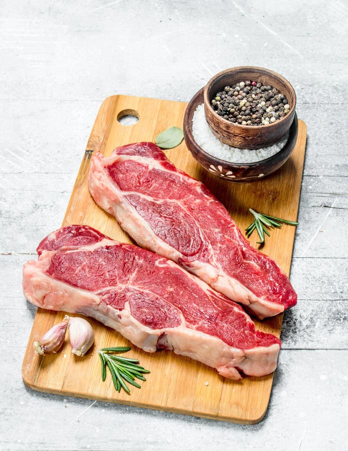 Raw Roast Beef with Herbs Tied with a Rope with Cooking Ingredients ...