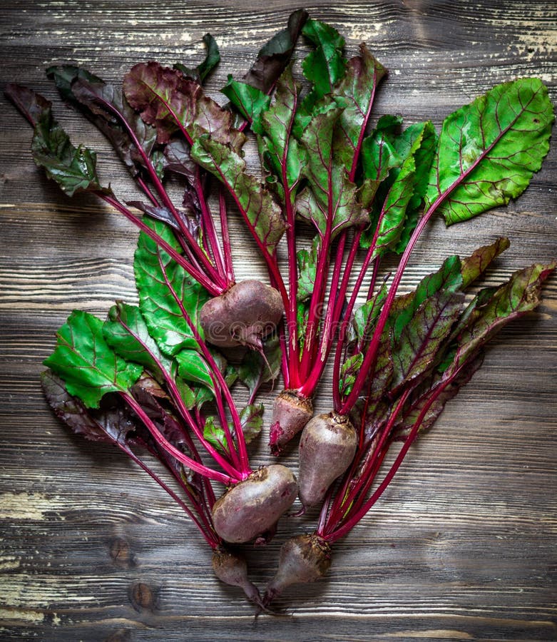 Raw Beetroot with Green Leaves on a Wooden Table Stock Image - Image of ...