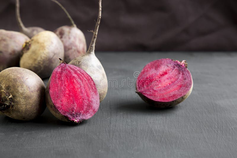 Raw Beetroot and Two Halves on Black Background, Side View. Stock Image ...