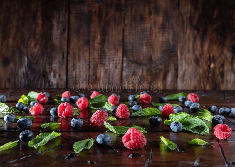 Raw Berries on a Wooden Background. Red and Black Berries. a Variety of ...