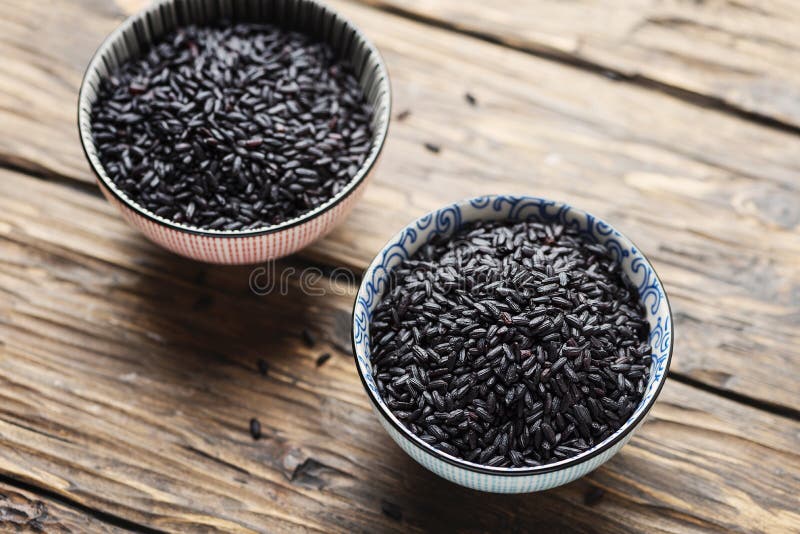 Raw black asian rice stock photo. Image of uncooked - 161887742