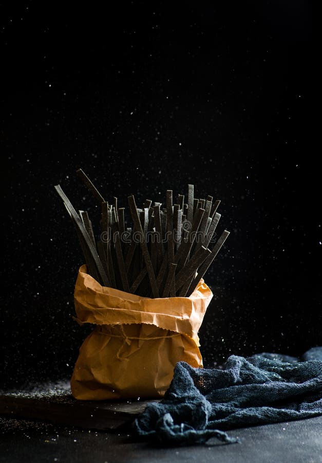 Raw black Italian paste stock image. Image of pasta - 138226453