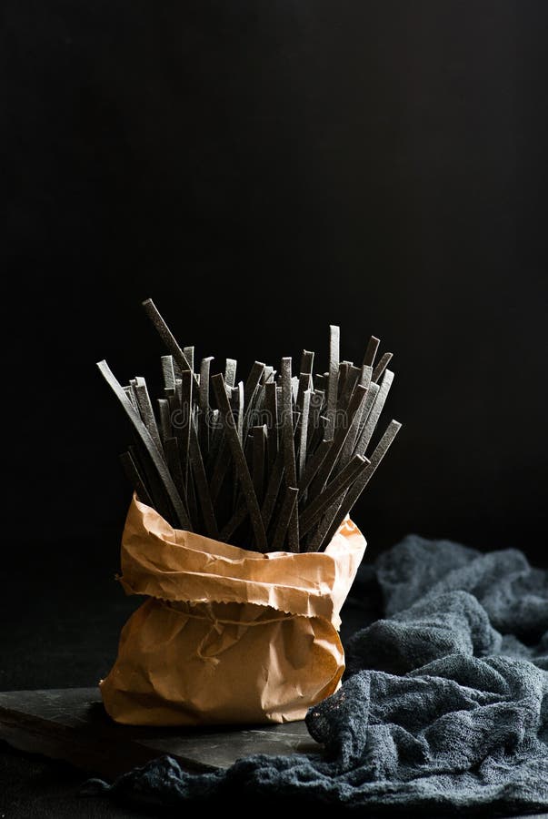 Raw black Italian paste stock image. Image of noodles - 138226519