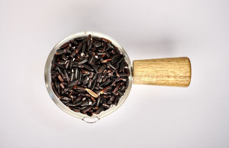 Raw Black Rice in Small Glass Pot with Wooden Handle Stock Image ...