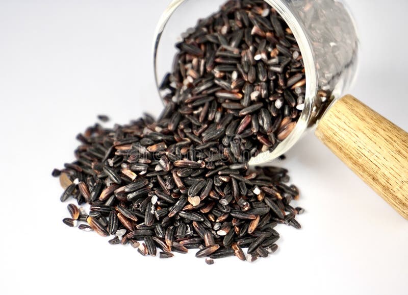 Raw Black Rice Spilled from Small Glass Pot Stock Photo - Image of ...