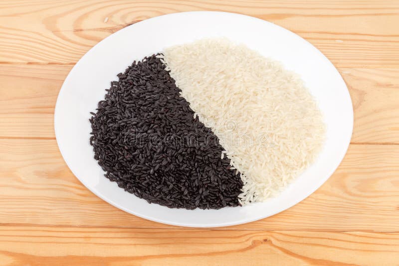 Raw Black and White Rice on Dish on Rustic Table Stock Photo - Image of ...