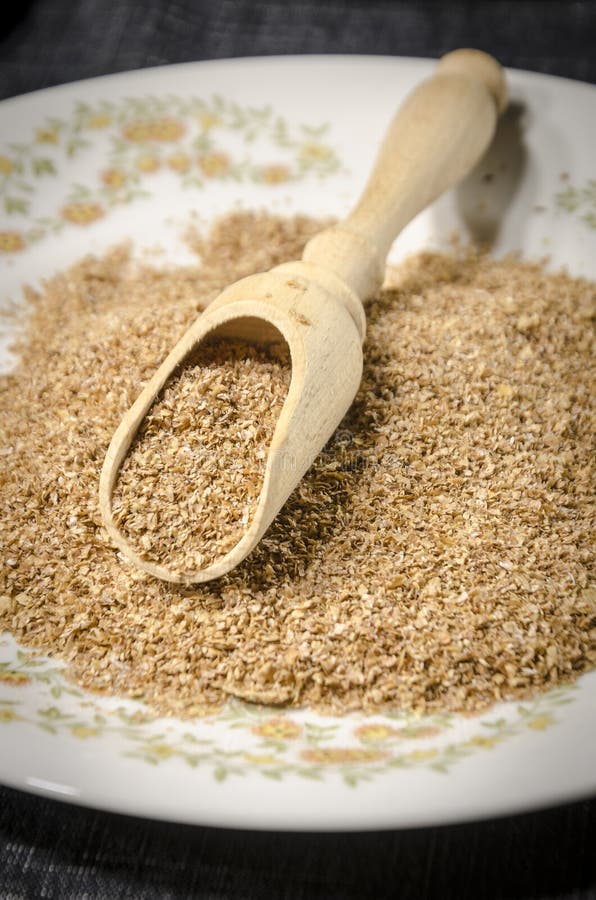 Spoon Of Wheat Bran On White Plate Stock Image - Image of ground ...