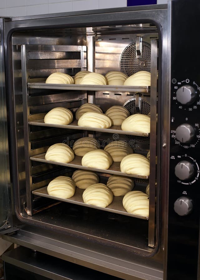 Raw Bread on a Baking Sheet Ready for Baking. Stock Image - Image of ...