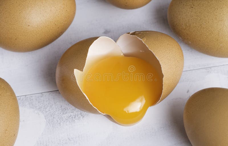 Raw Broken Chicken Egg , Egg Yolk in Shell Stock Photo - Image of ...