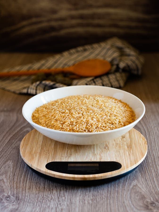 Raw brown rice on dish stock photo. Image of risotti - 301040334