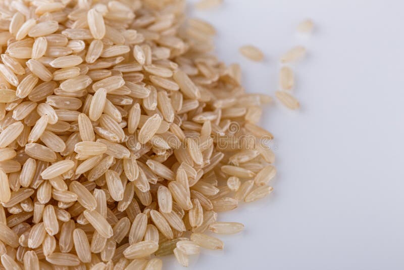 Raw Brown Rice on White Acrylic Background Stock Image - Image of ...