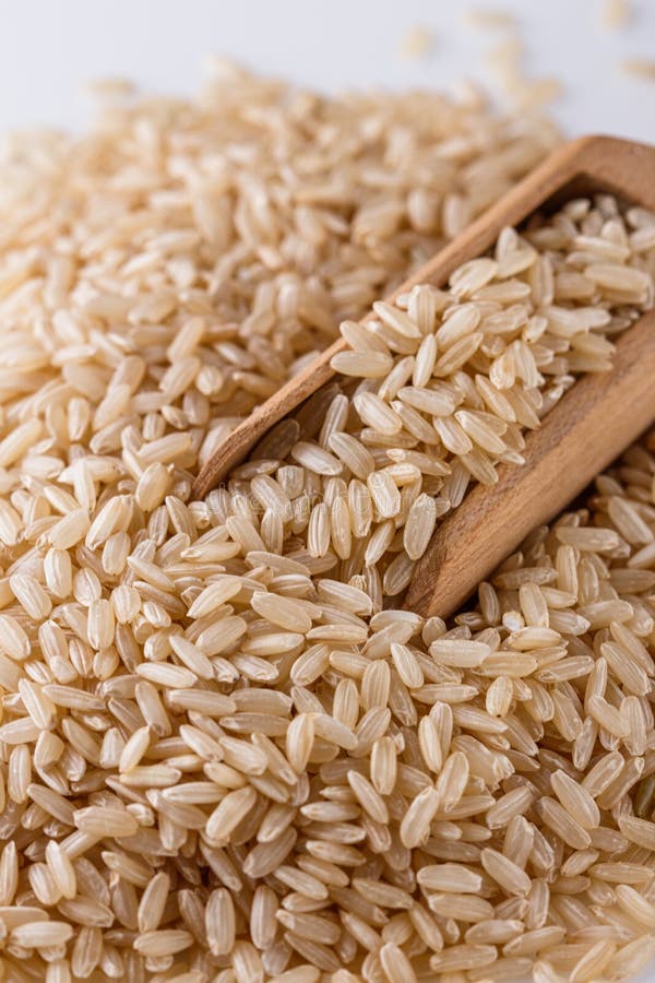 Raw Brown Rice on White Acrylic Background Stock Photo - Image of meal ...