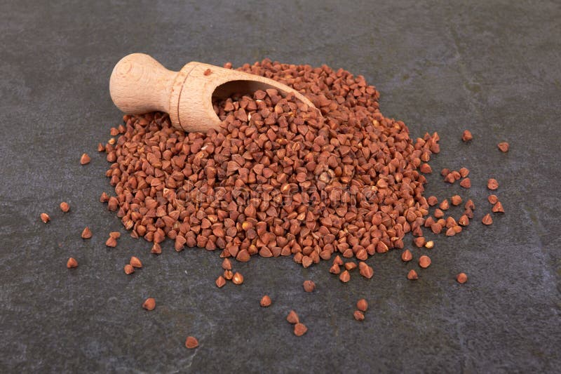 Raw buckwheat on black stock image. Image of crop, ground - 269888295
