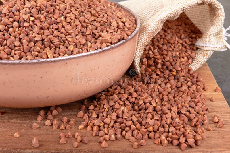 Raw buckwheat on black stock image. Image of crop, ground - 269888295