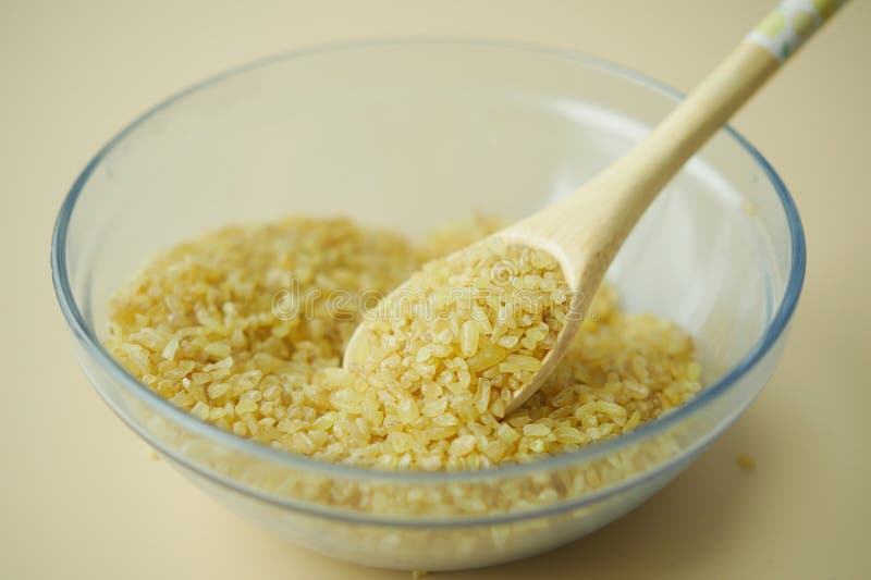 Raw Bulgur Rice in a Bowl on Table Stock Photo - Image of seed ...