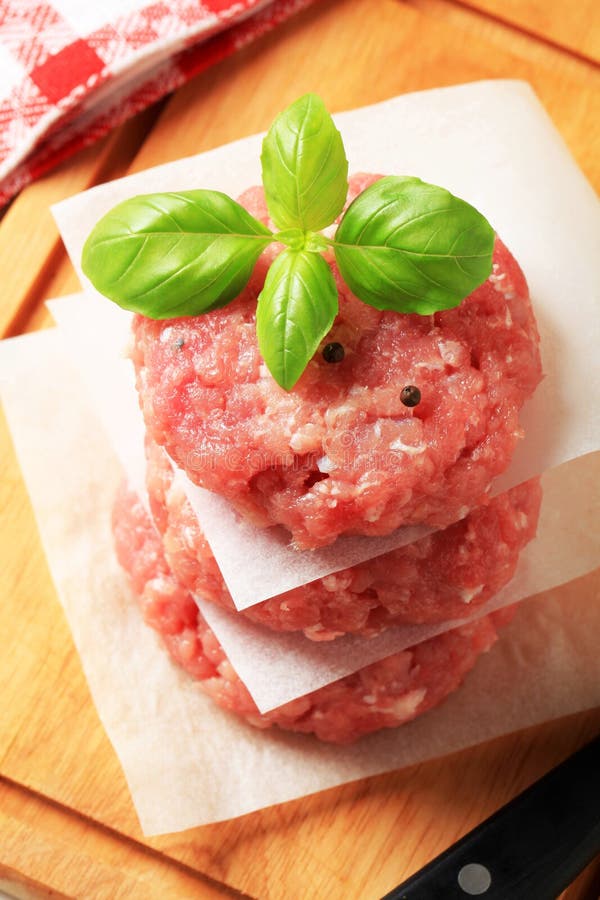 Raw burgers stock image. Image of pork, pile, basil, patty - 22036471