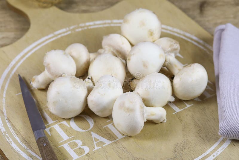 Raw button mushrooms stock photo. Image of freshness - 183270746