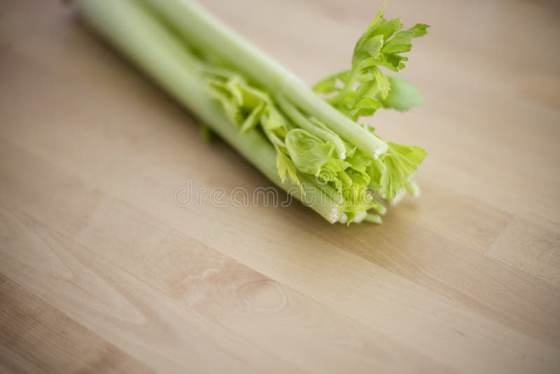 Raw celery on wood table stock photo. Image of nature - 58782956