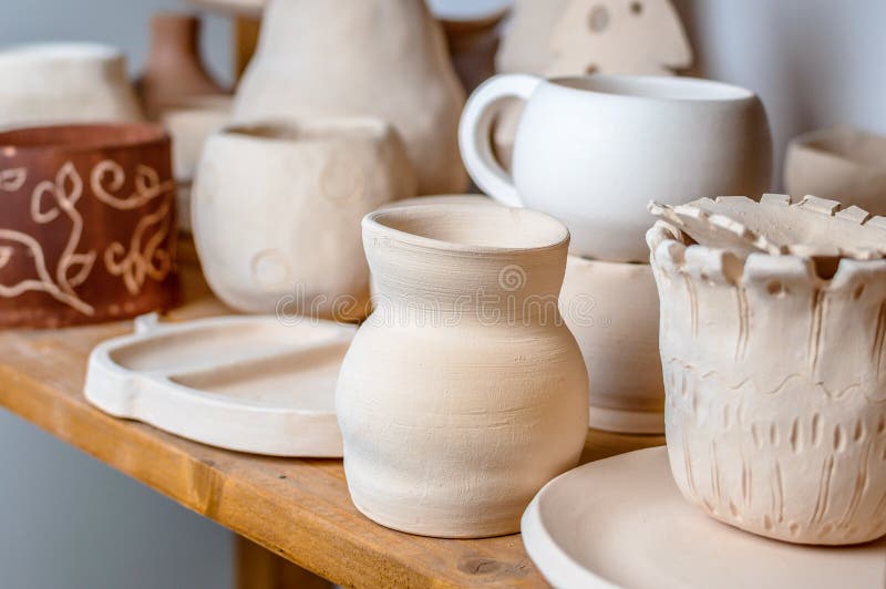 Raw Ceramic Cups on the Shelf Stock Photo - Image of cups, creativity ...