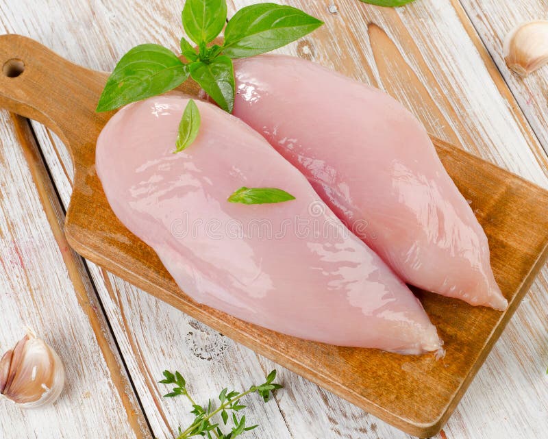 Raw chicken breast fillets stock image. Image of herb - 44385081