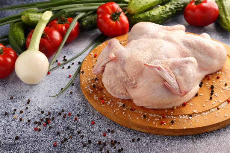 Raw Chicken Carcass on a Board with Vegetables Stock Photo - Image of ...