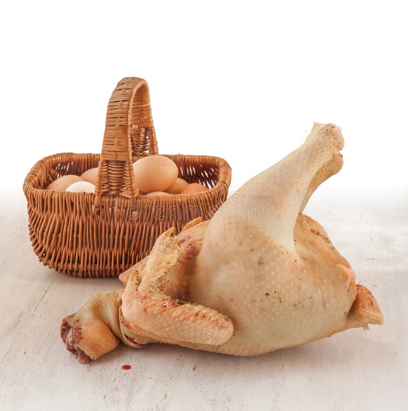 Raw Chicken Carcass Home on the Background Basket with Eggs Stock Image ...