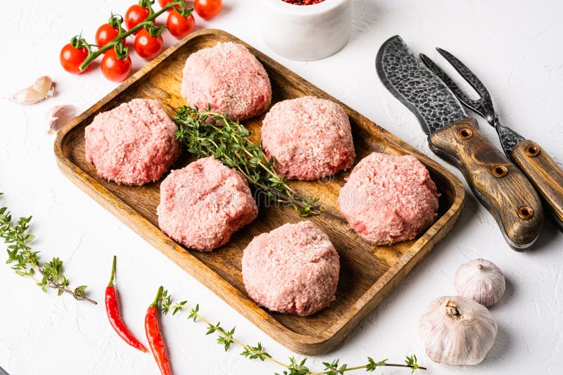 Raw Chicken Cutlets, Ground Meat Patty, on White Stone Table Background ...