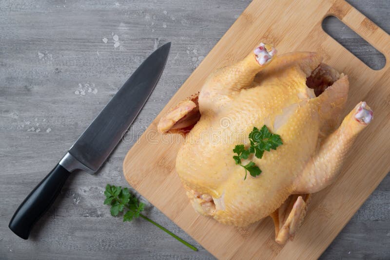 Raw Chicken on a Cutting Board and a Knife Stock Image - Image of ...