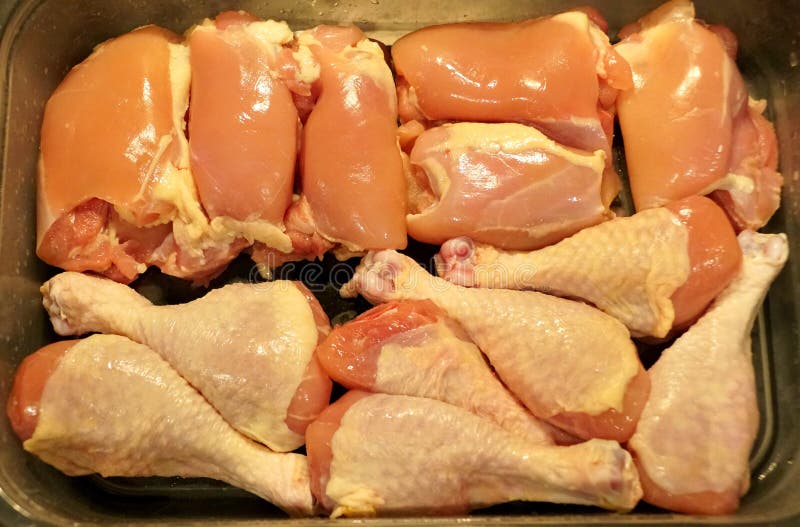 Raw Chicken Drumsticks and Breasts Inside a Container Stock Image ...