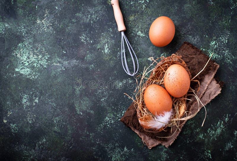 Raw chicken eggs and whisk stock photo. Image of farm - 106356464