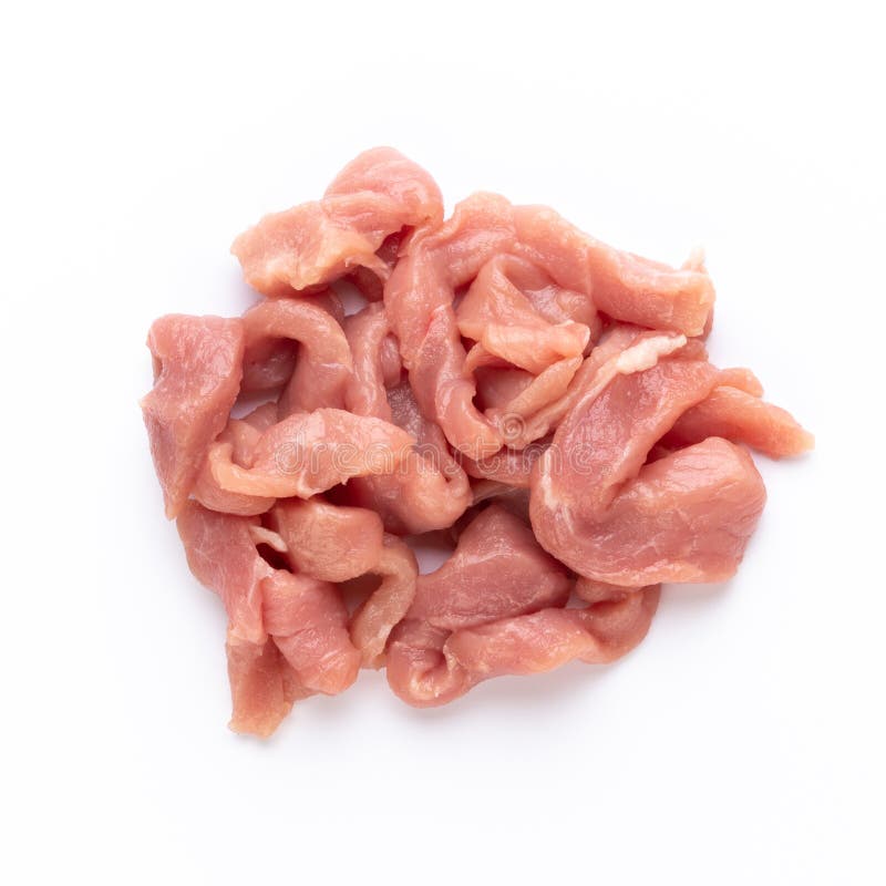Raw Chicken Fillet. Small Pieces of Meat Isolated on White Stock Photo ...