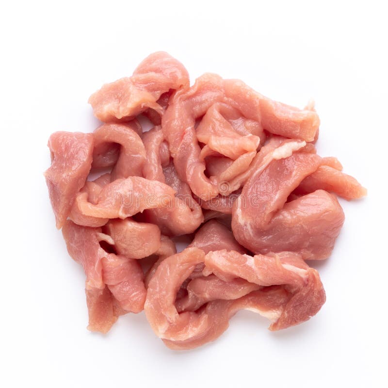 Raw Chicken Fillet. Small Pieces of Meat Isolated on White Stock Photo ...