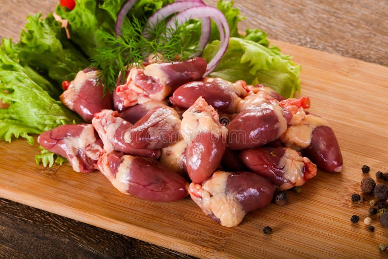 Raw chicken hearts stock photo. Image of heap, liver - 111867574