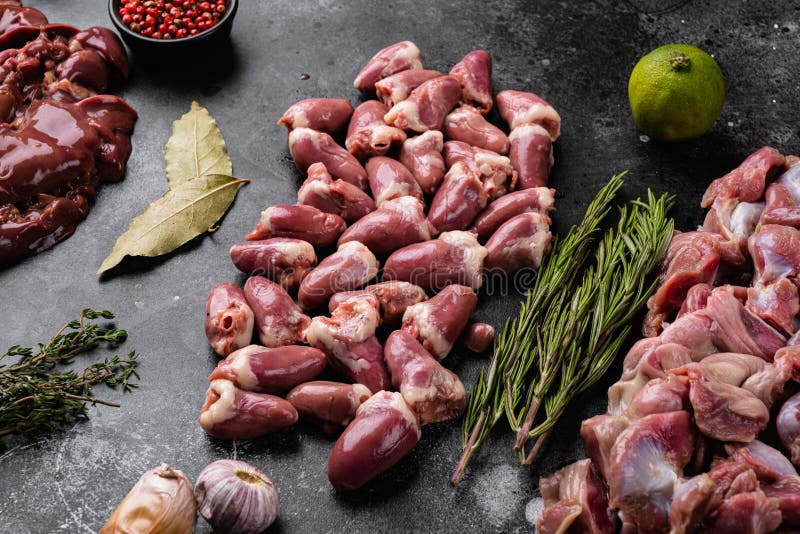 Raw Chicken Hearts Meat, on Black Dark Stone Table Background Stock ...