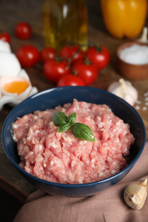 Raw Chicken Minced Meat with Basil and Ingredients on Table Stock Image ...