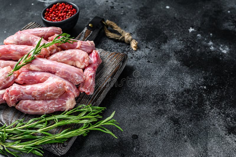 Raw Chicken Neck Meat on a Cutting Board. Black Background. Top View ...
