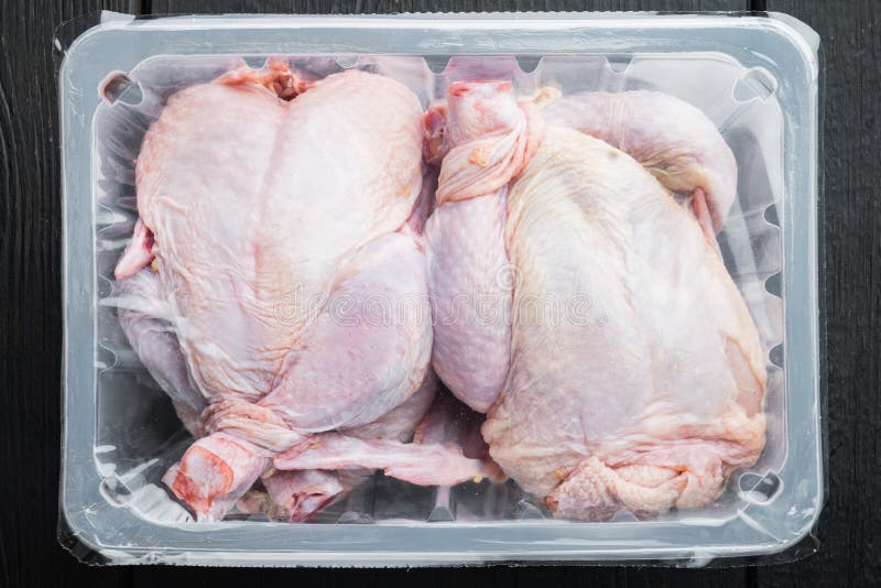 Raw Chicken in Plastic Sealed Box, on Black Wooden Table, Top View ...