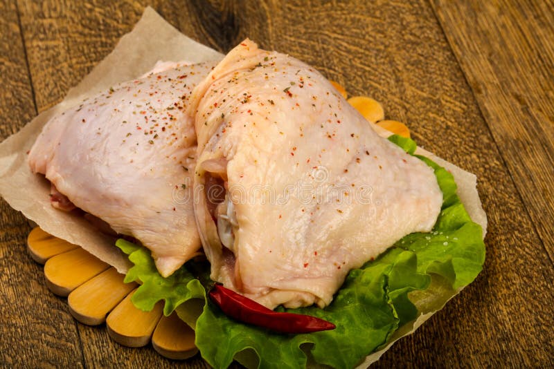 Raw chicken thigh stock photo. Image of food, cutting - 112066294