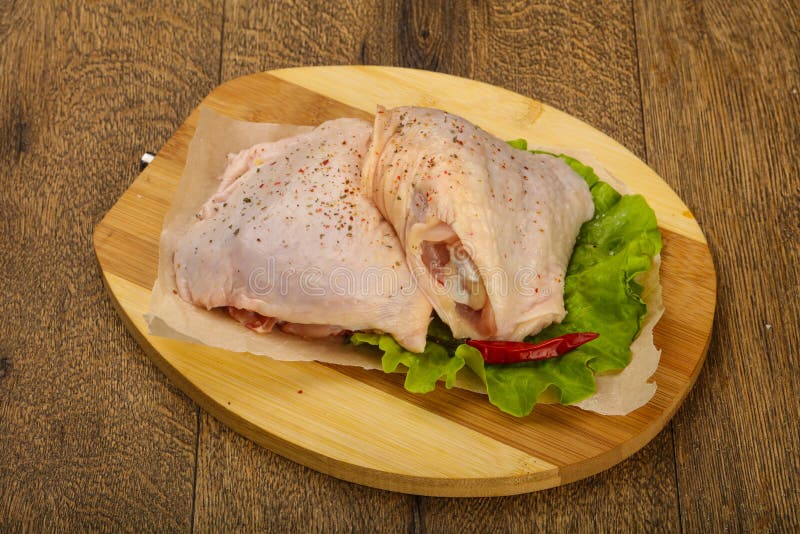 Raw chicken thigh stock photo. Image of dinner, cutting - 112879458