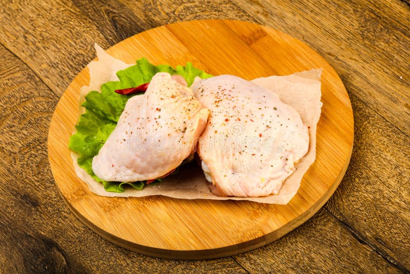 Raw chicken thigh stock photo. Image of dinner, board - 117854400