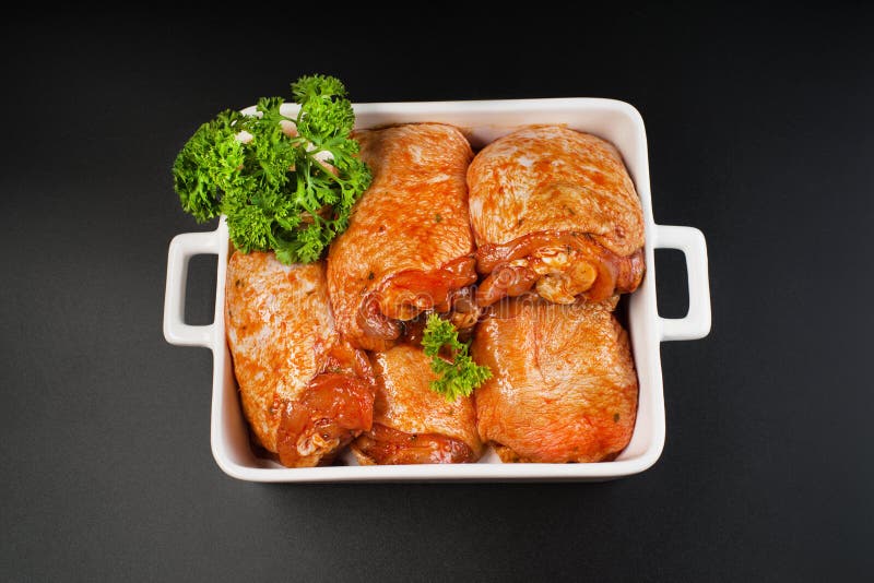 Raw Chicken Thighs Marinated in Red Sauce. Chicken Semi-cooked Thighs ...